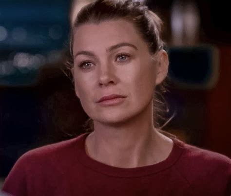 A Woman In A Red Shirt Looking At The Camera With An Intense Look On
