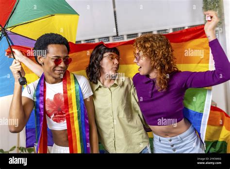 Non Binary And Transgender People Dancing Waving Rainbow Lgbt Flag