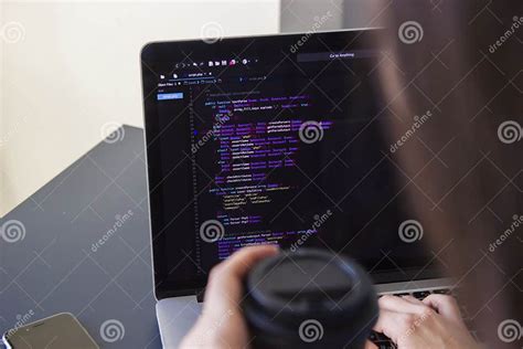 A Programmer Coding On A Laptop In The Workplace Stock Image Image Of