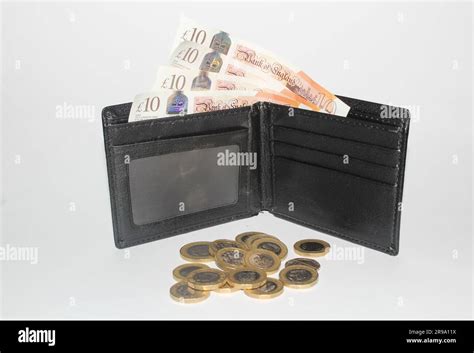 An Wallet Full Of British Money Coins And Notes Of The Realm Sterling