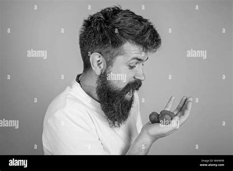 Hipster Bearded Holds Strawberries On Palm Man Shouting Hungry Greedy