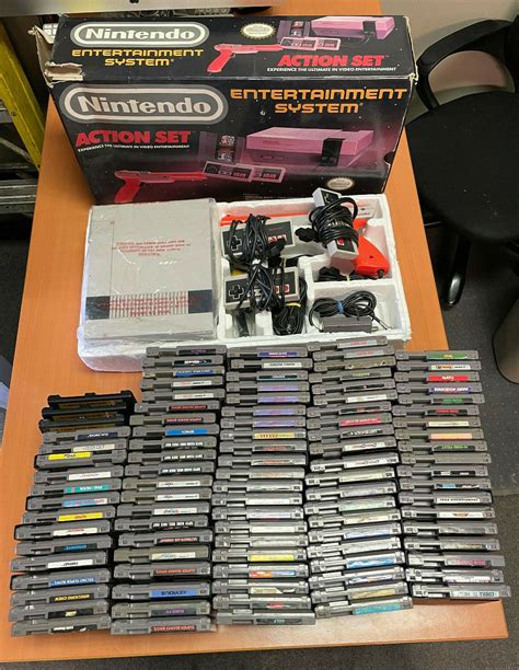 NINTENDO NES CONSOLE ACTION SET USED IN ORIGINAL BOX WITH 99 GAMES