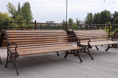 Premium Photo Wooden Benches In The City Park Park Bench On The Street
