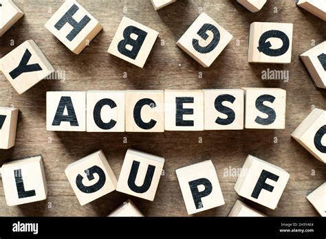 Alphabet Letter Block In Word Access With Another Block On Wood Background Stock Photo Alamy