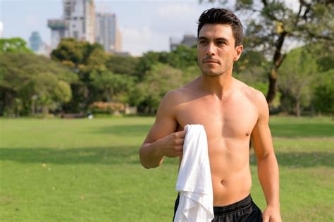 Premium Photo Full Length Of Shirtless Man Standing On Field