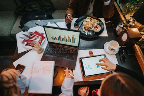 Collaboration And Data Analysis During A Business Strategy Meeting At A