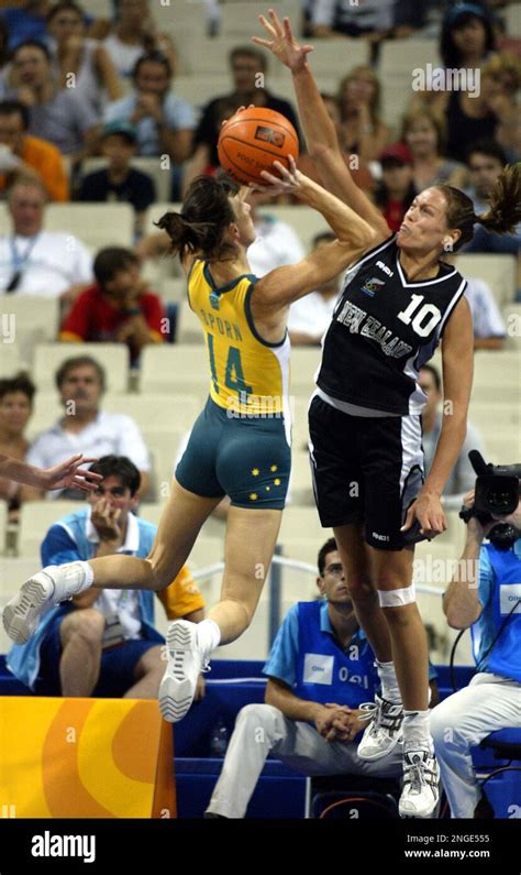 New Zealands Gina Farmer Left Goes Up To Block The Shot Of Australia