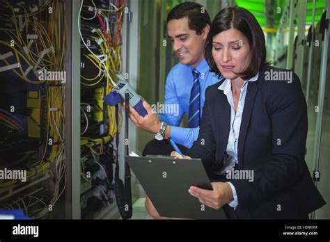 Technicians Analyzing Rack Mounted Server Stock Photo Alamy