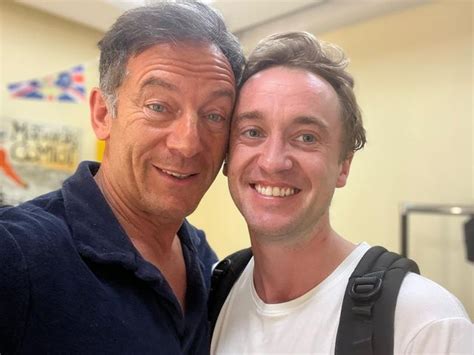 Two Men Posing For The Camera