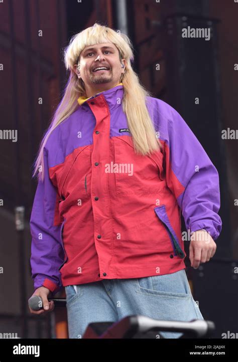 Singer Songwriter And Filmmaker Oliver Tree Is Shown Performing On Stage During A Live Concert