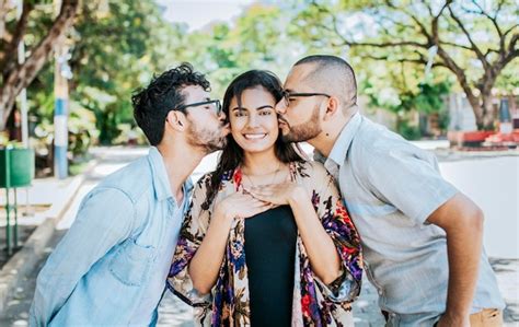 Premium Photo Two Men Kissing A Girl Cheek Portrait Of Two Guys