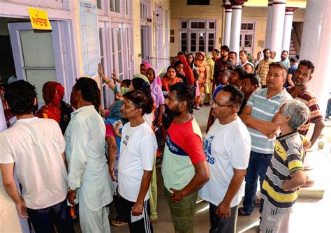 Voters Stand In Queue To Cast Their Vote In The Seventh And Last Phase
