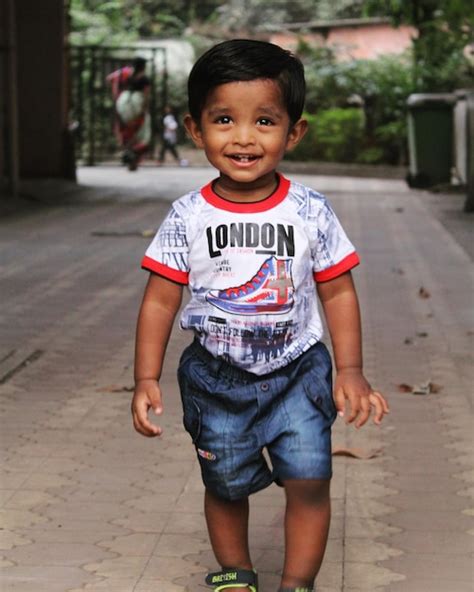 Premium Photo Cute Boy Walking On Footpath