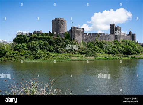 View Of Pembroke Castle Over Pembroke River Waterway Blue Sky Stock
