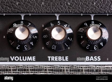 Detail Of The Volume Treble And Bass Control Knobs Of A Guitar Amplifier Equalization Dials