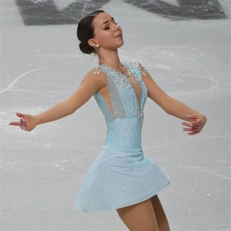 A Female Figure Skating On An Ice Rink