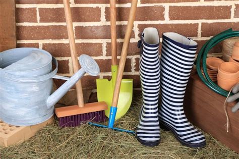 Premium Photo Tools Of Gardener On Bricks Background