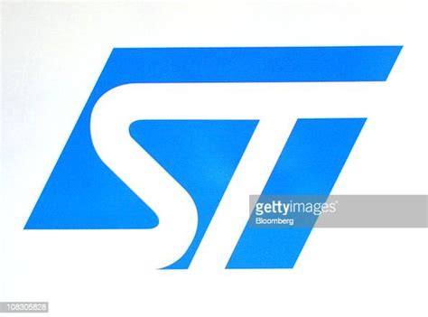 The Stmicroelectronics Nv Company Logo Sits On Display At A News