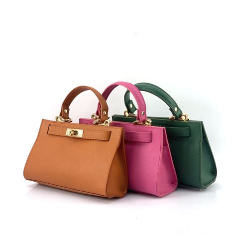 Borsa piccola artigianale in pelle modello birkin con tracolla