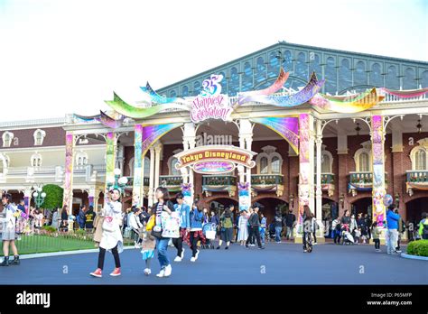 Tourist Around The World Visiting Tokyo Disneyland In The Event Of