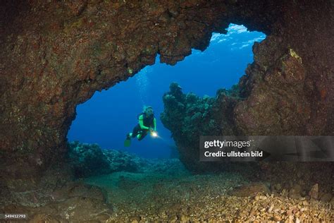 Diver At Caves Of Lava Tubes Cathedrals Of Lanai Maui Hawaii Usa