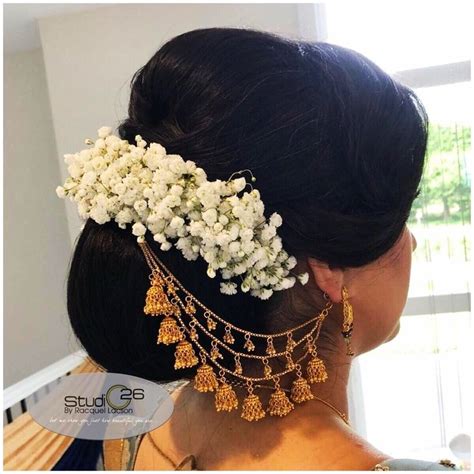 Gorgeous Low Bun Hairstyle With Flower Gajra