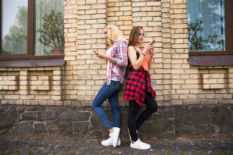 Young Happy Hipster Teenage Girls Having Fun In Summer Park Stock Image