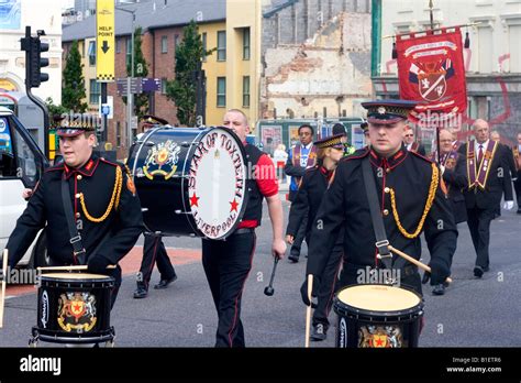 Members Of The Orange Lodge Parade Through The Streets Of Liverpool UK