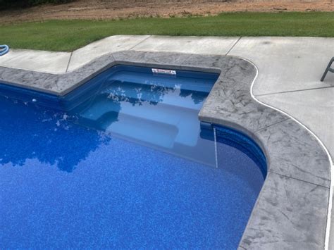 Polymer Vinyl Liner Pool With Stamped Colored Concrete Cantilever Edge