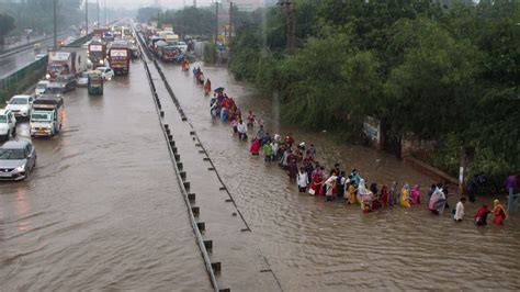 Delhi Rains Roads Cave In Schools To Be Shut In Noida Work From Home