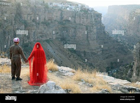 Kurdish Couple In Traditional Dress At A Viewpoint In The Zagros