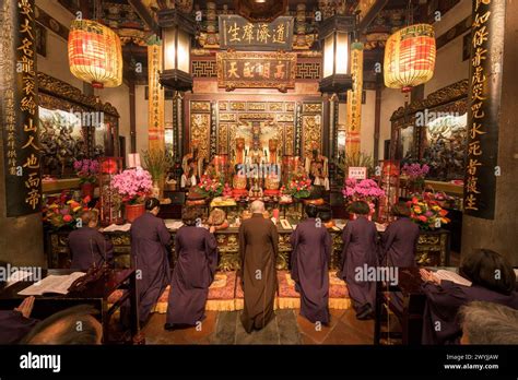 Devotees With Offerings During A Religious Ceremony For The Chinese New