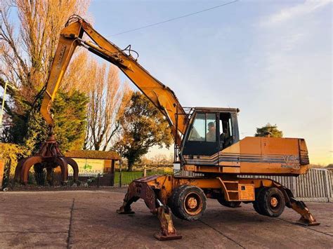 Case 1188 Poclain 4wd Wheeled Scrap Handler C W 5 Tine Scrap Handler