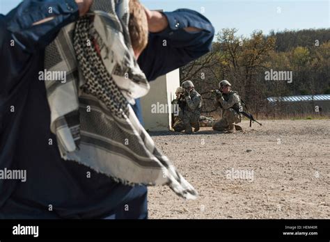 Capt Robert Bohl Staff Sgt Patrick Hoglund And Staff Sgt Aaron Vannett Halt An Insurgent So