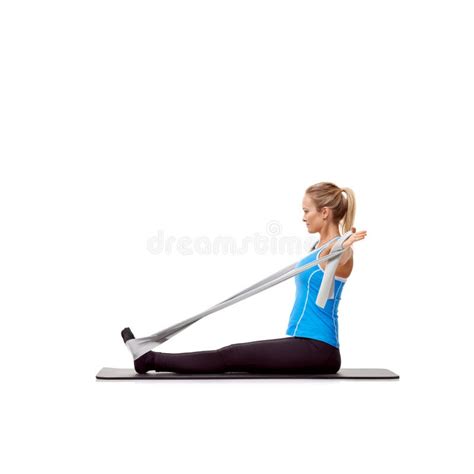 Building Those Biceps A Young Blonde Woman Sitting On A Mat And