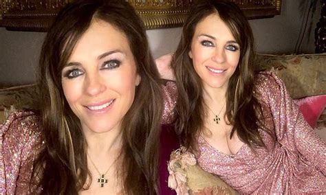 Elizabeth Hurley Puts On A Busty Display In A Plunging Pink Sequinned
