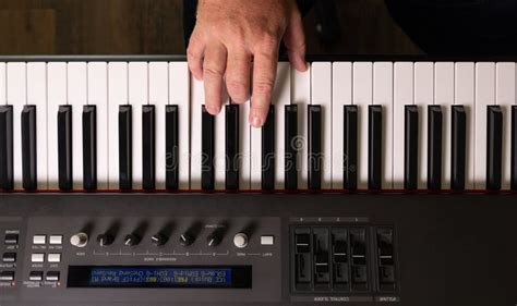 hands practicing on the electronic piano keyboard stock image image