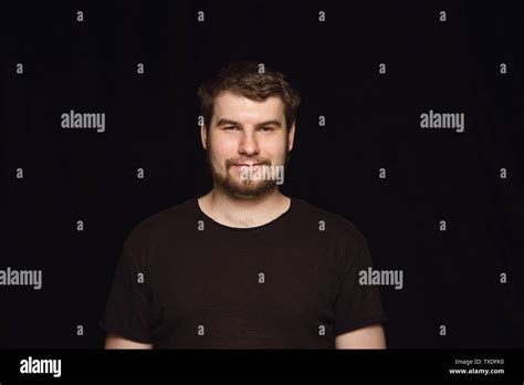 Close Up Portrait Of Young Man Isolated On Black Studio Background