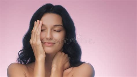 Beautiful Woman With Perfect Skin And Closed Eyes Touching Face Stock