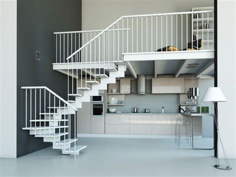 A White Kitchen With Stairs Leading Up To The Top Floor And An Open