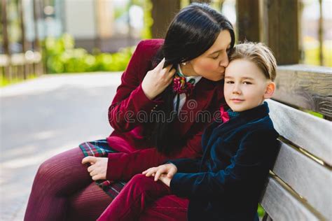 Trendy Mother Kissing Her Stylish Son Outdoor Stock Image Image Of