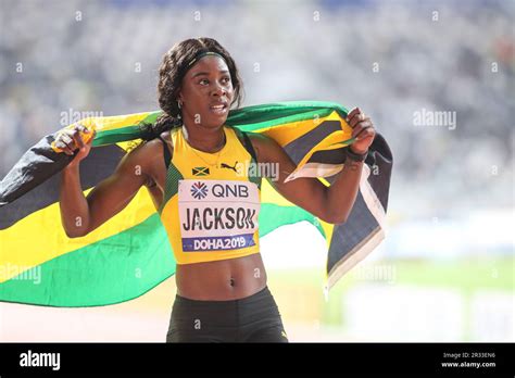 Shericka Jackson With His Countrys Flag In The 400m At The 2019 World