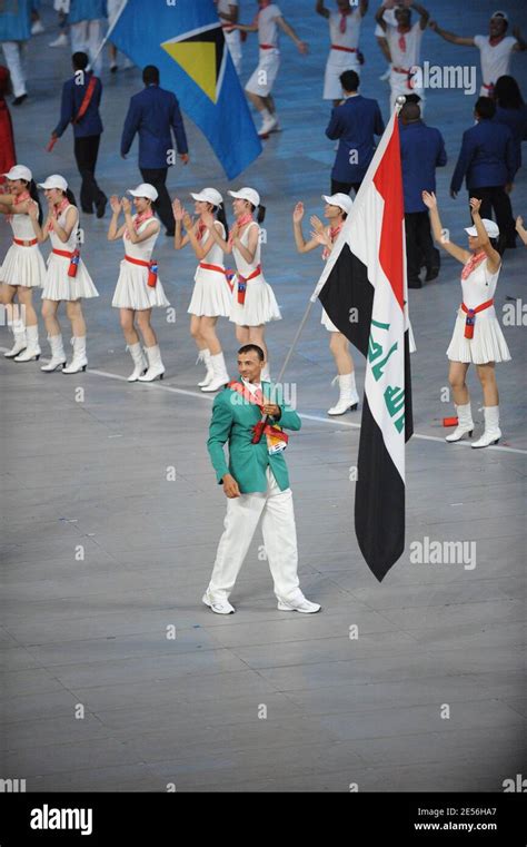 Rower Hamzah Al Hilfi Of Iraq Carries His Nations Flag During The Opening Ceremony For The 2008