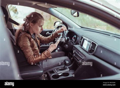 Woman Driving Car Selects Navigation On Phone S Display Screen Turns Voice Assistant Searches