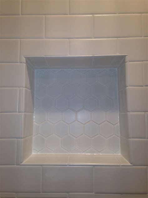 Shower Niche With Hexagon Shaped Tile Which Mimics The Floor Tile Shape