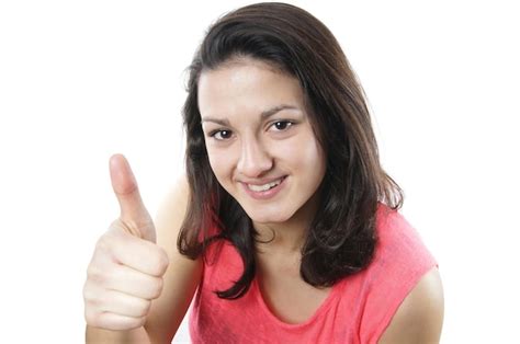 Premium Photo Portrait Of Smiling Young Woman Gesturing Thumbs Up