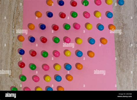Candy Is Arranged On Colorful Paper Creating Repetitive Patterns