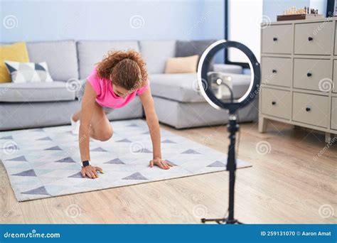 Young Beautiful Hispanic Woman Having Online Legs Training Class At