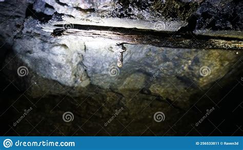 A Drop Of Water Hangs On A Rusty In The Cave Stock Image Image Of