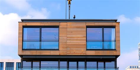 Modular Wooden Building Module Lifted By Crane Into Berlin Office Construction Site Concept